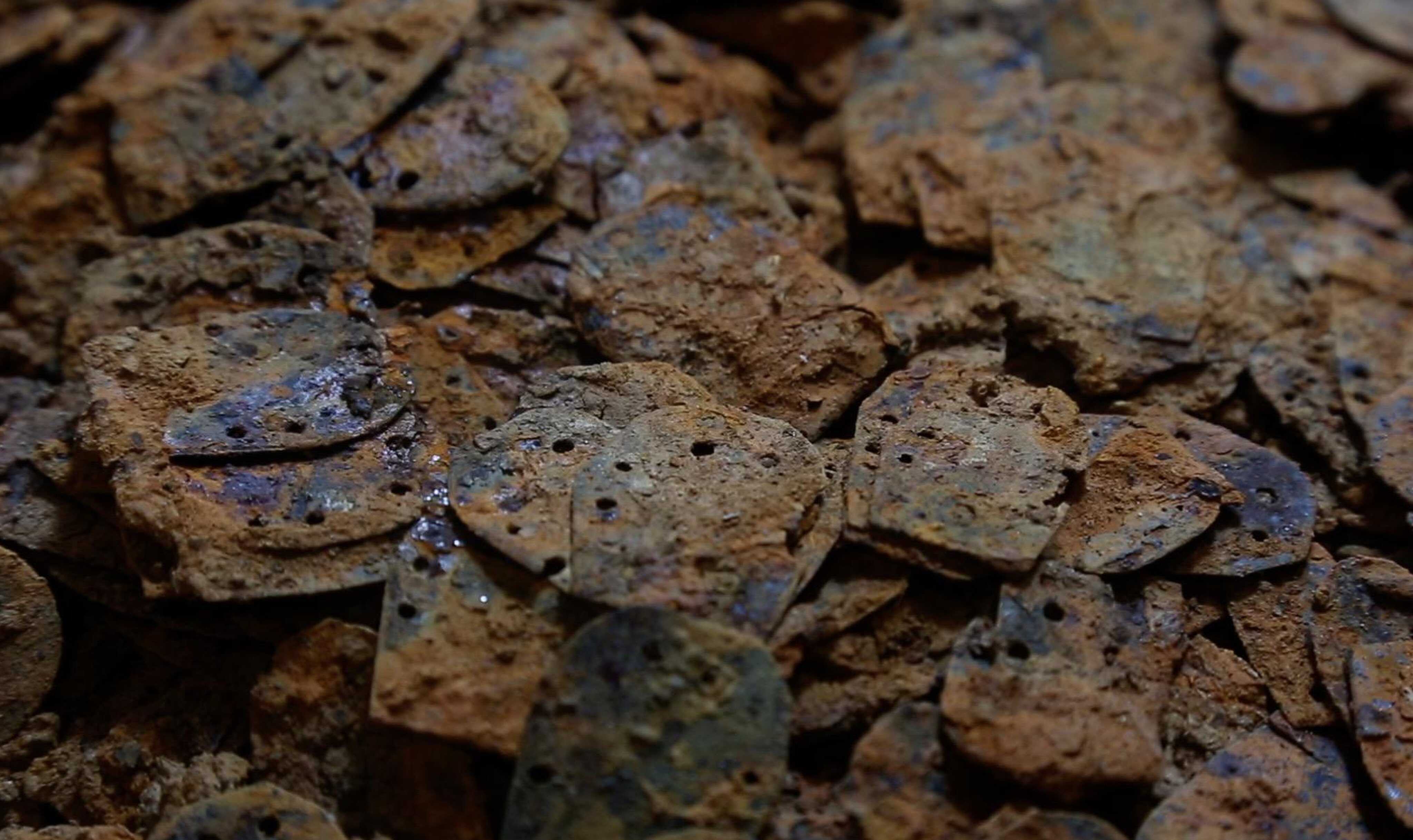 Archaeologists in China reconstruct 6,000 miniature armour scales from ...