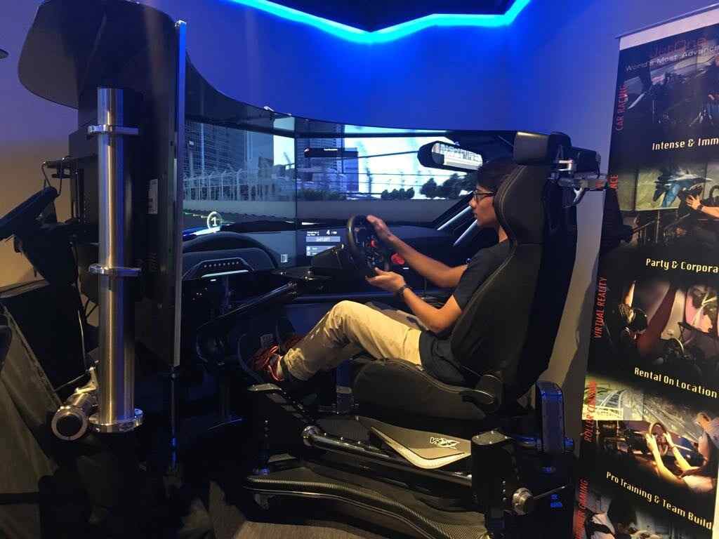 Fly a plane and race a car in a VR simulator that feels like the real ...