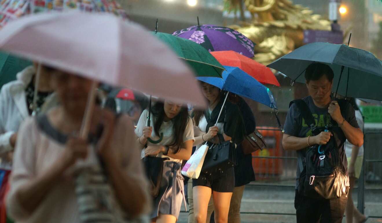 UPDATED: Hong Kong Observatory lowers weather signal to amber rainstorm ...